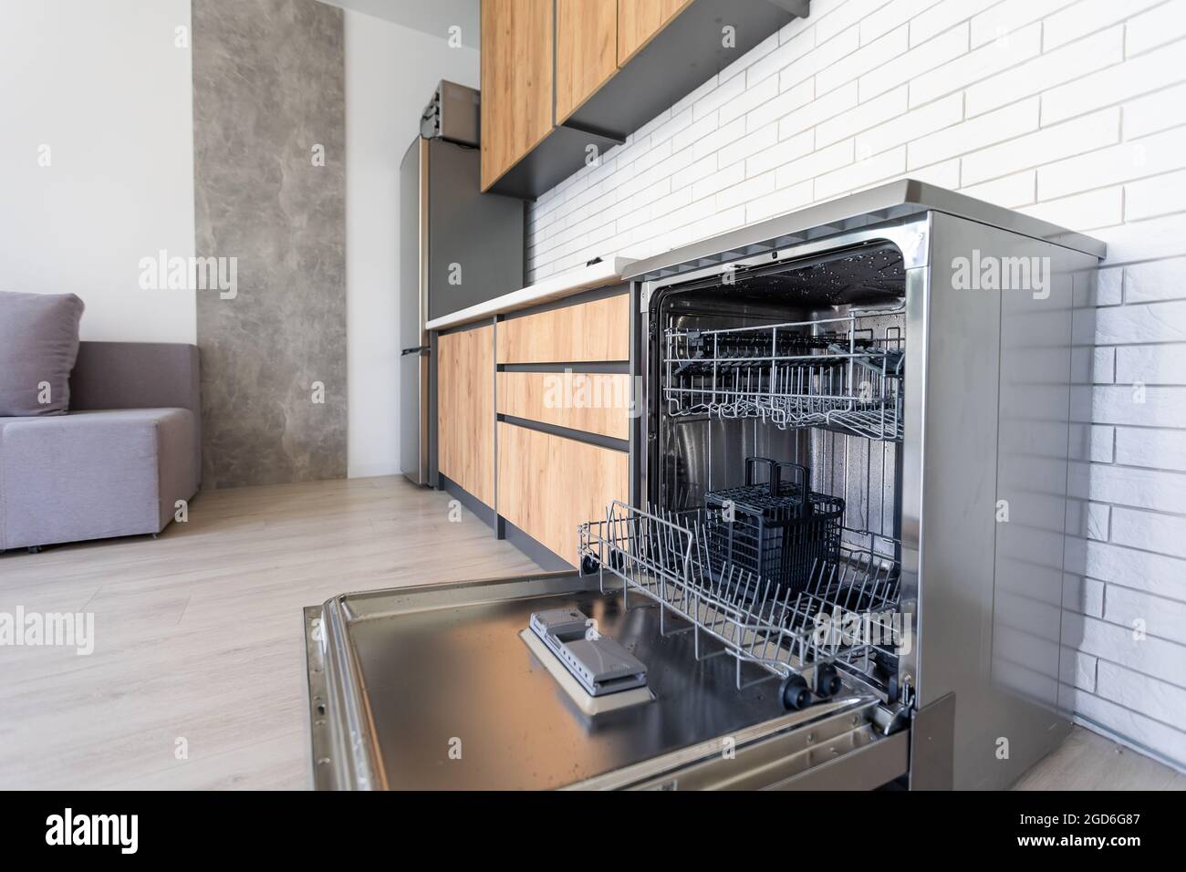 modern Half open empty dishwasher in a modern kitchen Stock Photo - Alamy