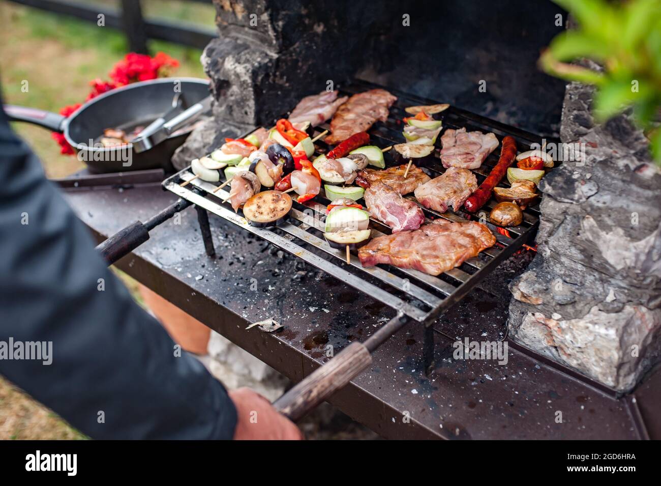 People Grilling Food