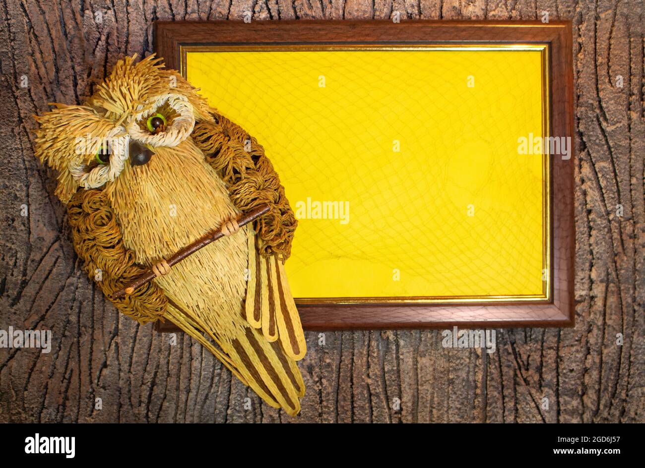 Owl. Frame with yellow background in frame with web for text. Tree bark ...