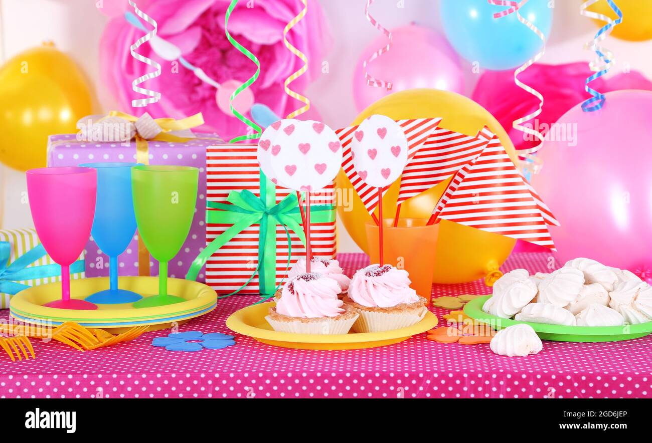 Festive table setting for birthday on celebratory decorations Stock ...