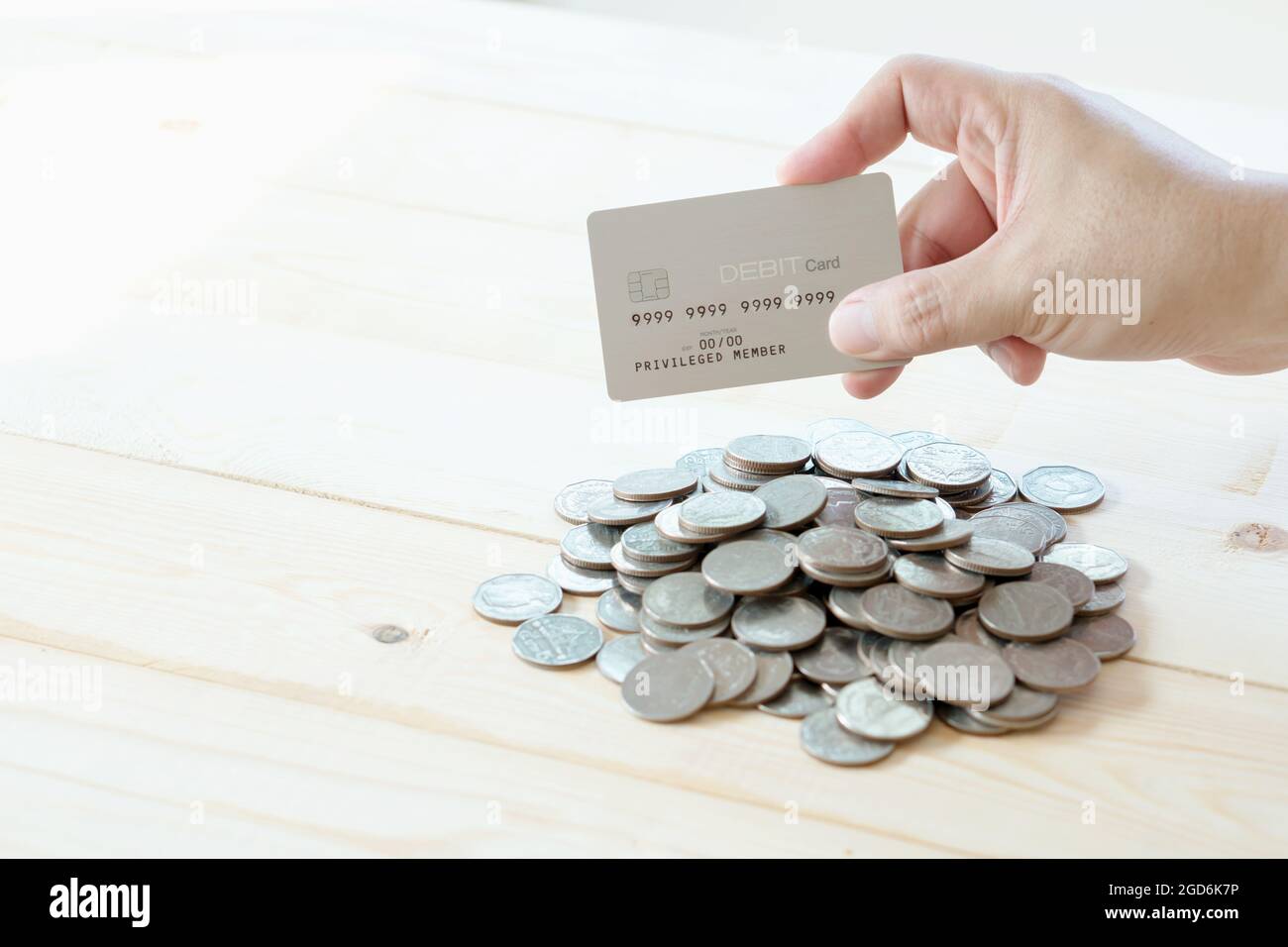 A Dedit cards with coins Stock Photo - Alamy