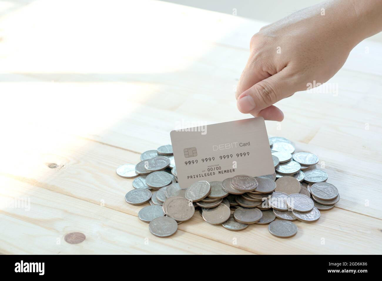 A Dedit cards with coins Stock Photo - Alamy