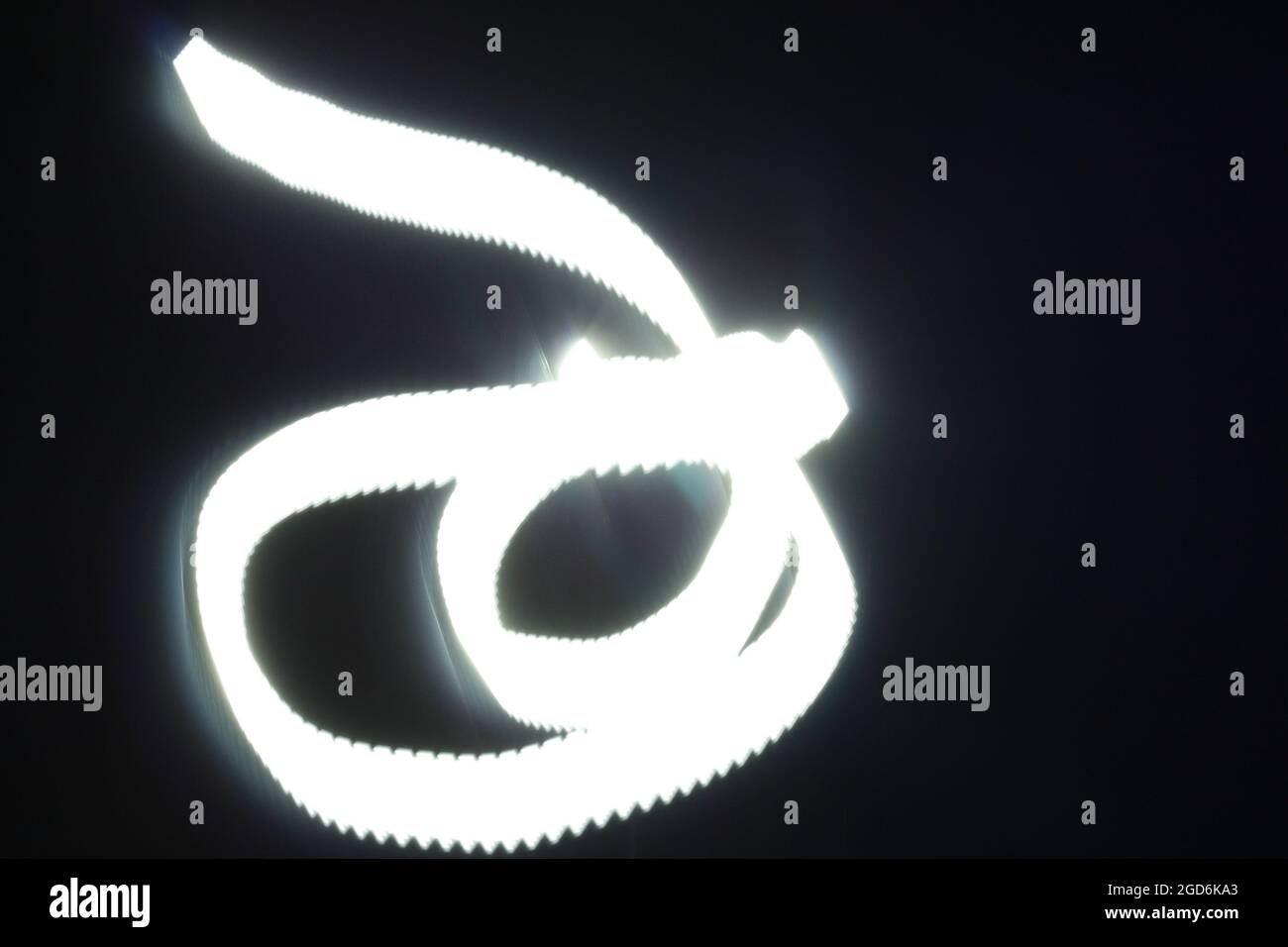 Luminous white track on a night background, blurred abstract background ...