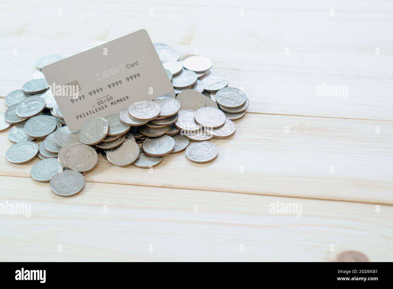 A Dedit cards with coins Stock Photo - Alamy