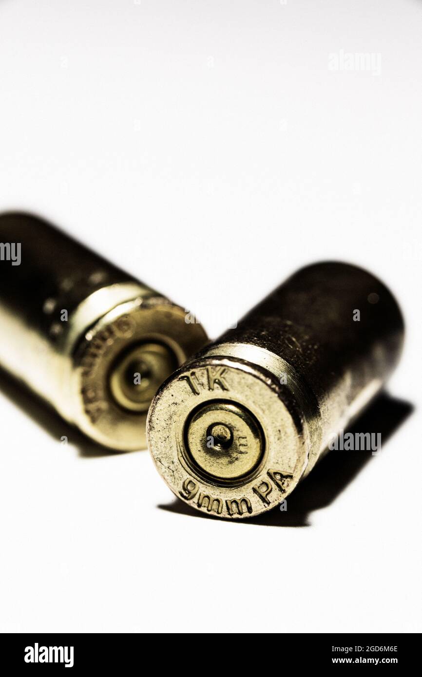 Two used cartridges cases on white background Stock Photo - Alamy