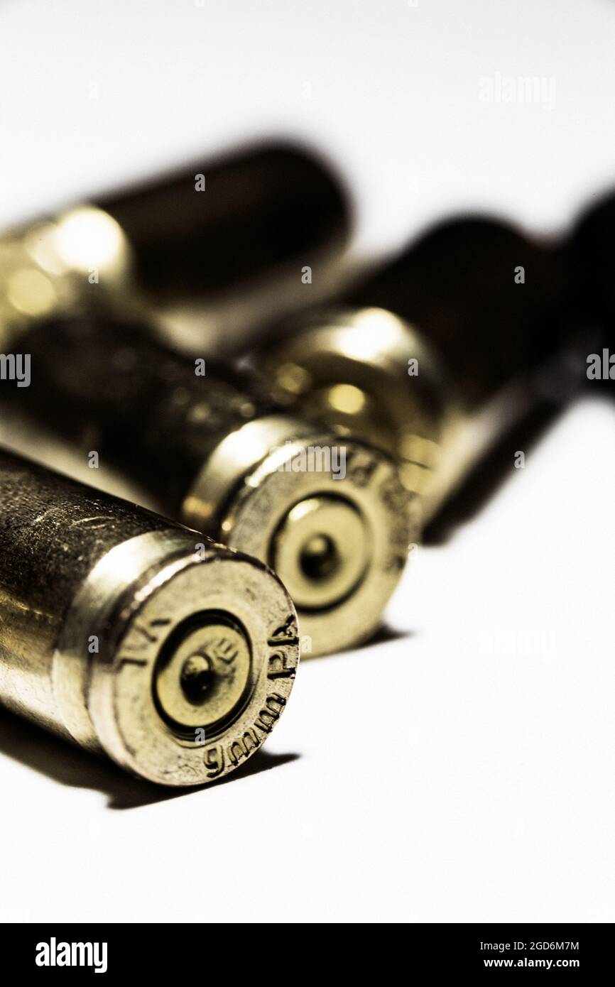 Several used cartridge cases on white background Stock Photo - Alamy