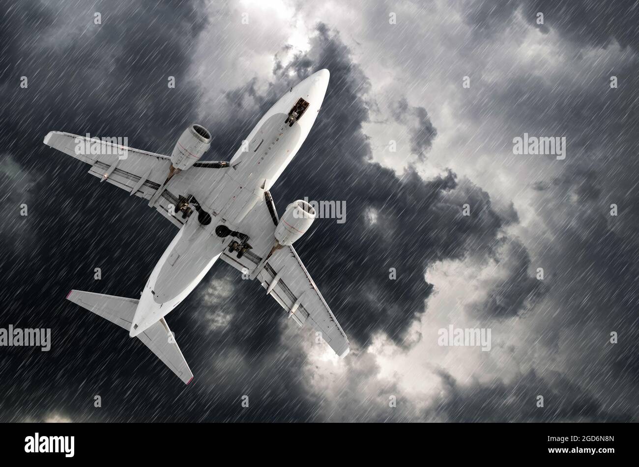 Airplane approach at the airport landing in bad weather storm hurricane ...