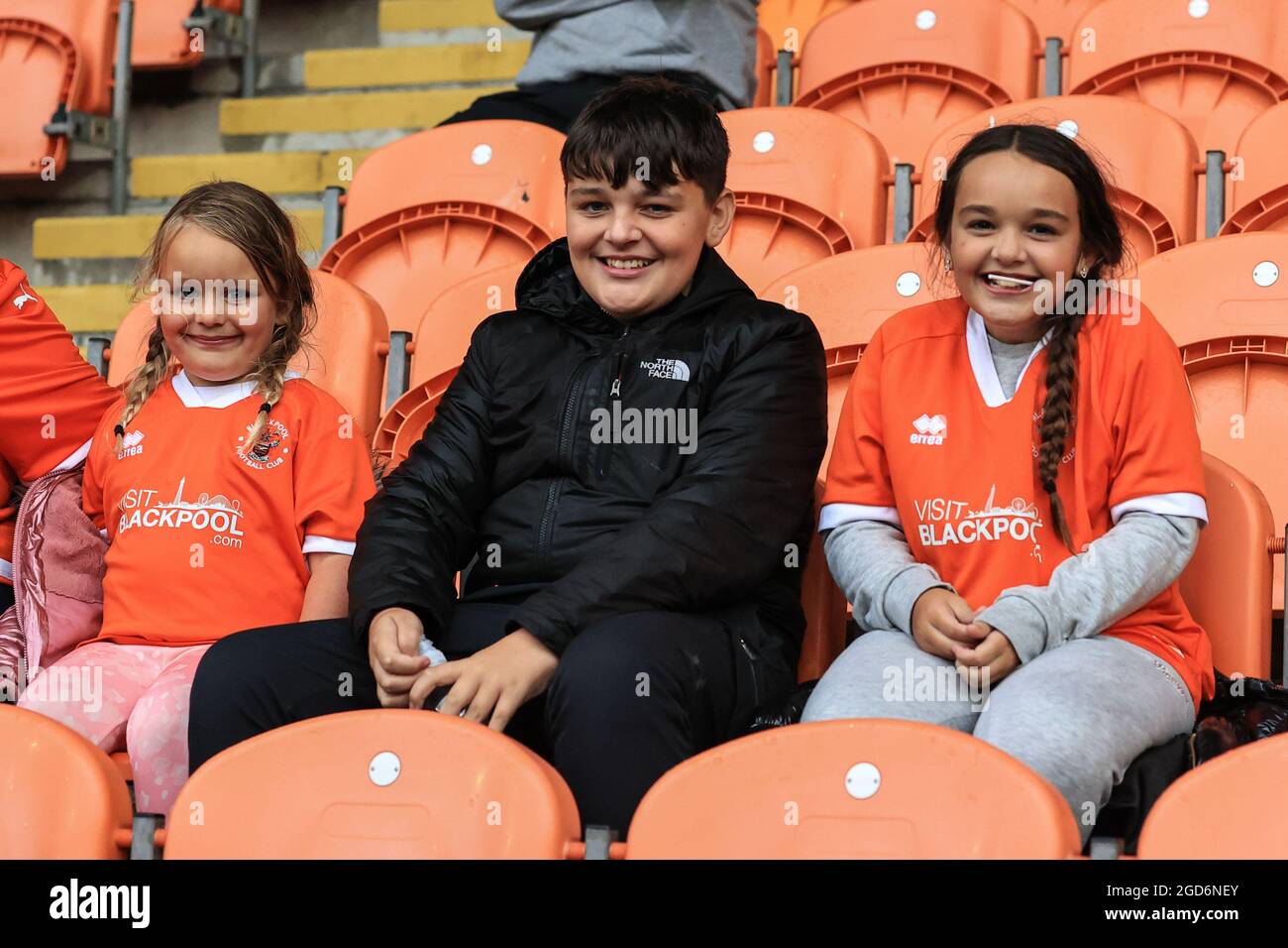 Blackpool fans watching their team warm up Stock Photo - Alamy