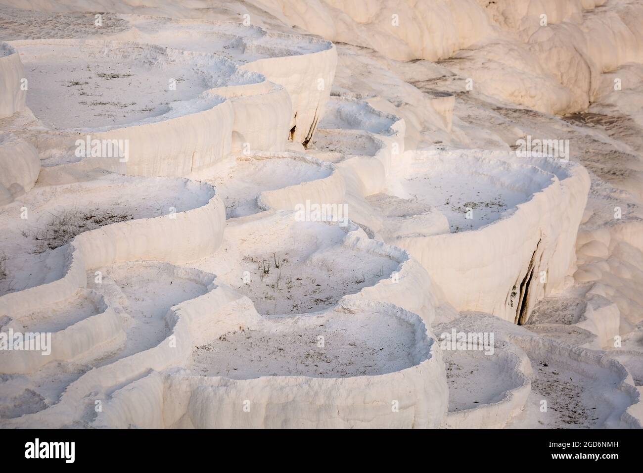 Pamukkale carbonate mineral field at sunset Stock Photo - Alamy