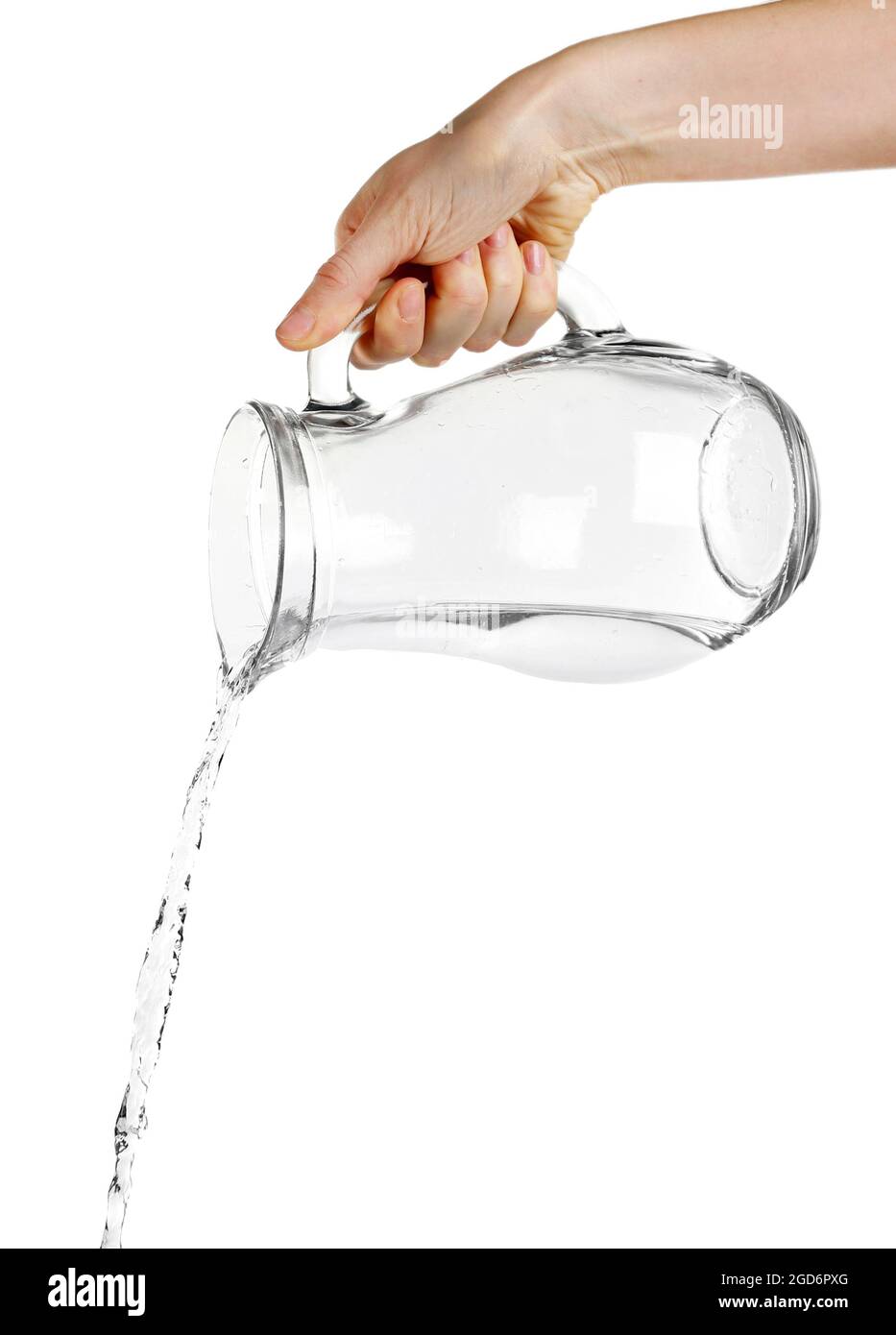 Pouring water from glass pitcher, isolated on white Stock Photo - Alamy