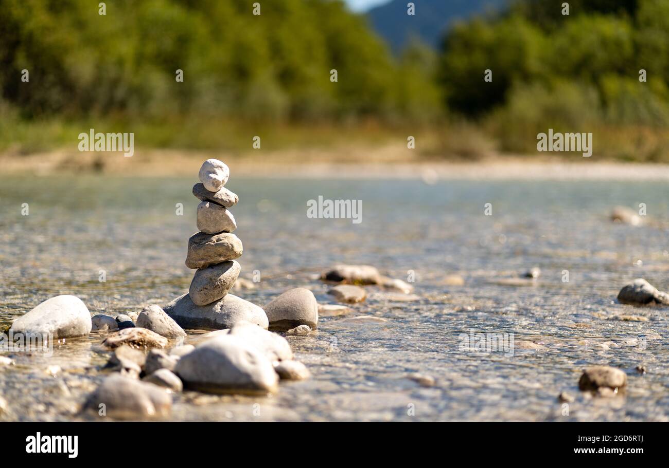 Stone tower in shallow river Stock Photo - Alamy