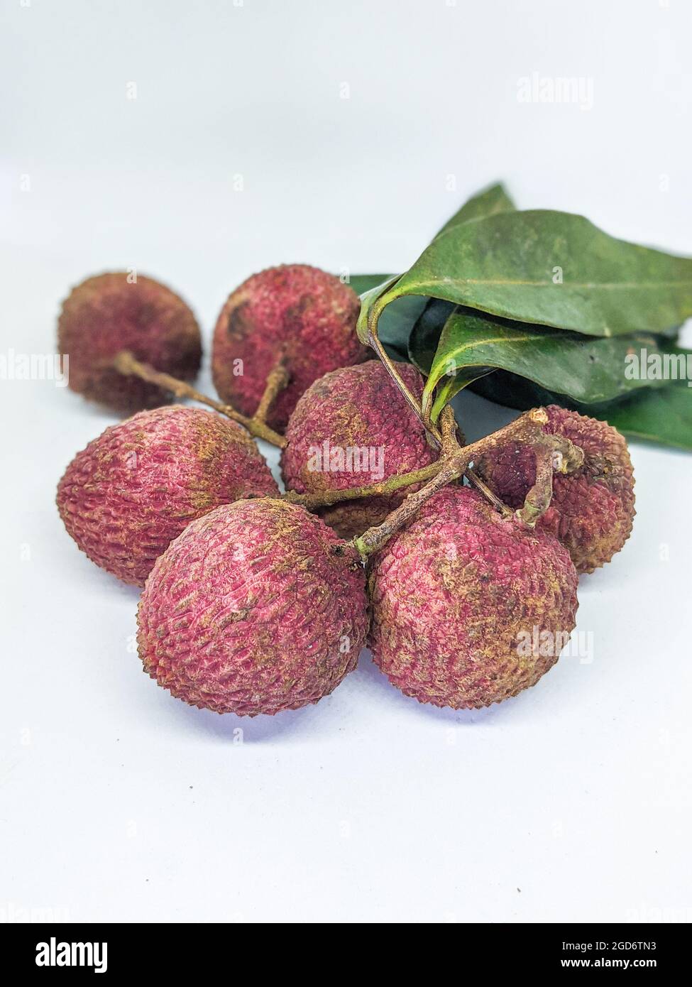 Vertical shot of Lychees isolated on a white background Stock Photo - Alamy