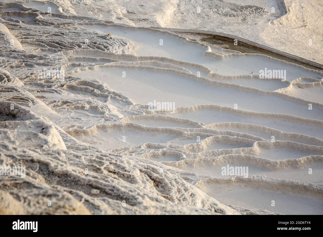 Pamukkale carbonate mineral field at sunset Stock Photo - Alamy