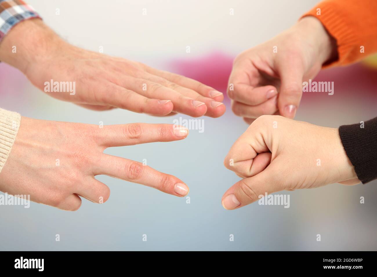 Scissors, paper, stone, scissors - hands on light background Stock ...