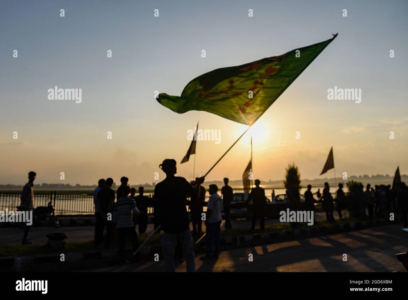 Srinagar, India. 11th Aug, 2021. A silhouette of a Shia Muslim boy ...