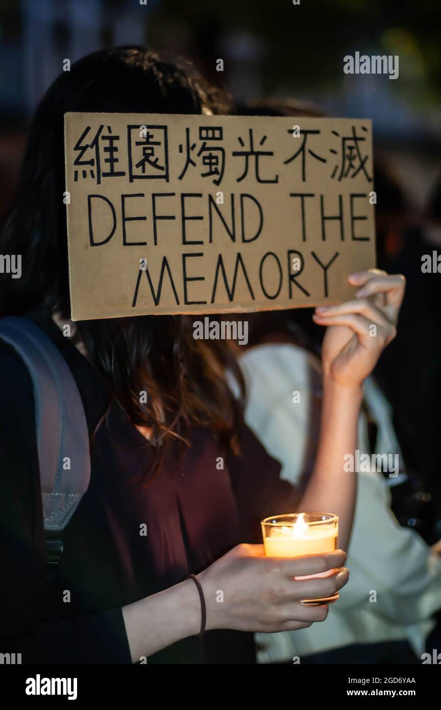 LONDON, ENGLAND- 4 June 2021: Woman holding a placard at Remember ...