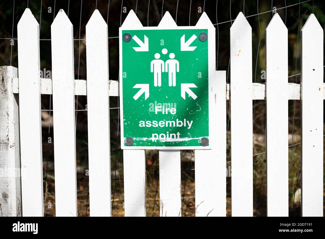 Fire assembly point sign at workplace signpost Stock Photo - Alamy