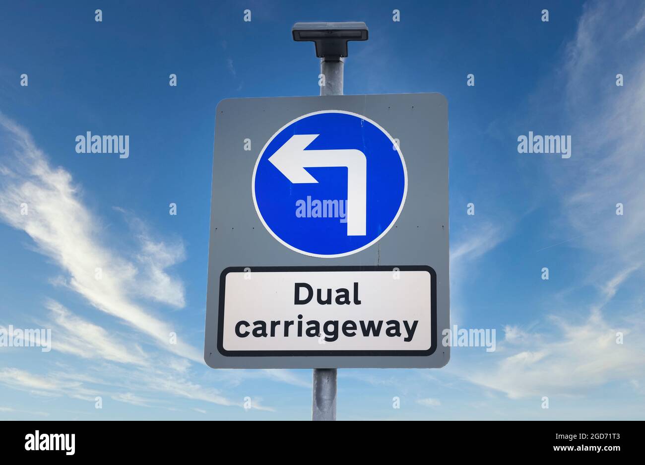 Dual carriageway direction motorway road sign against sky Stock Photo ...