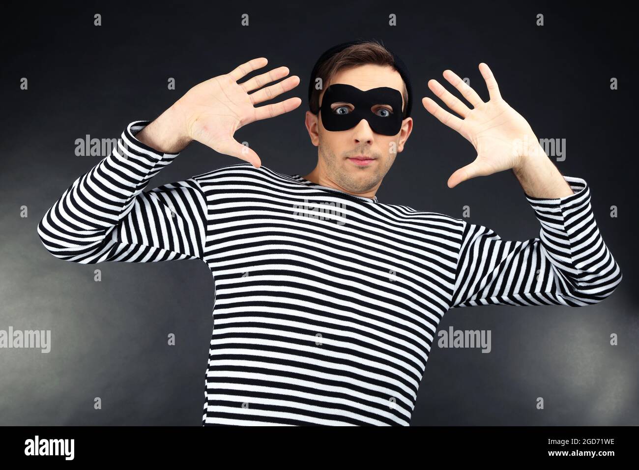 Thief on dark background Stock Photo - Alamy