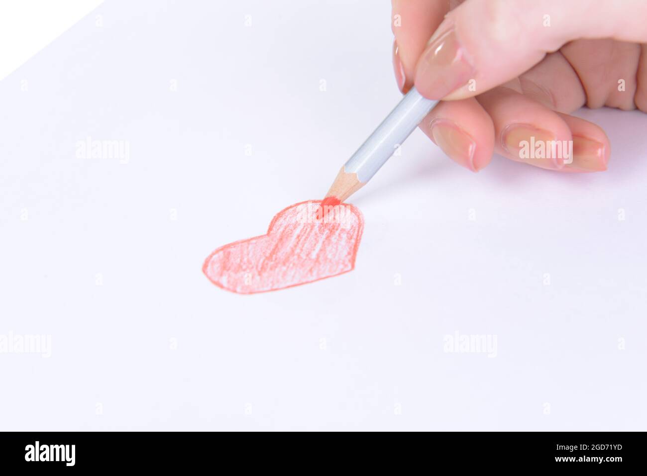 Heart drawn in pencil on a paper sheet close-up Stock Photo - Alamy