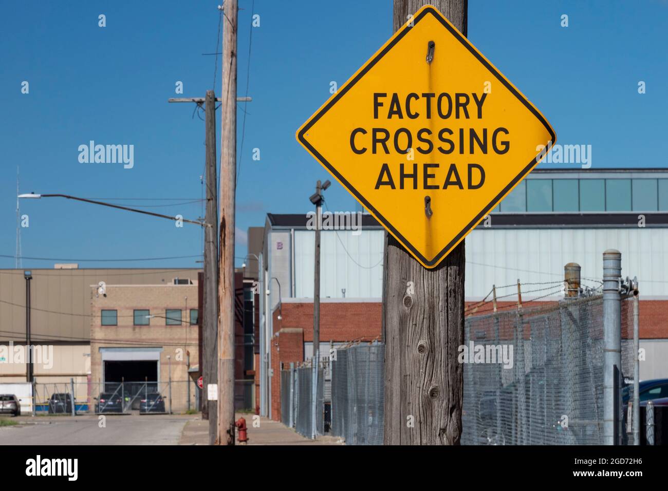 Detroit, Michigan - A road sign warns of a factory crossing Stock Photo ...