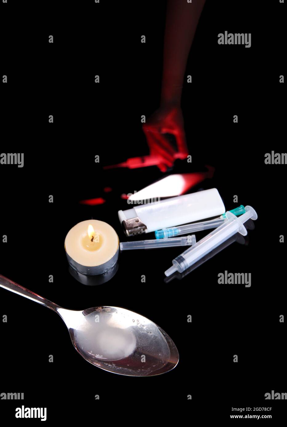 Heroin in spoon and syringes on black background Stock Photo - Alamy
