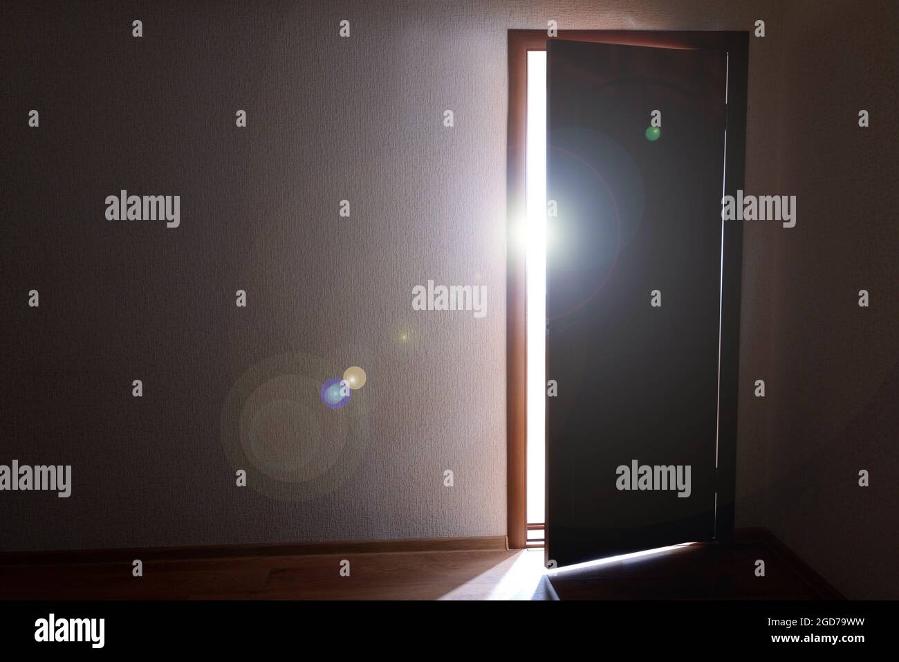 Open door with bright light outside Stock Photo - Alamy