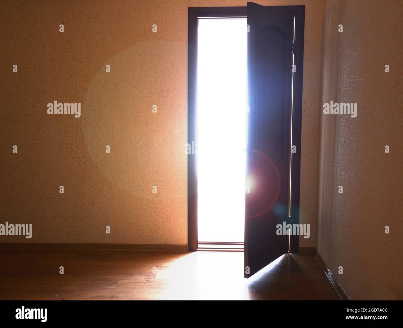 Open door with bright light outside Stock Photo - Alamy
