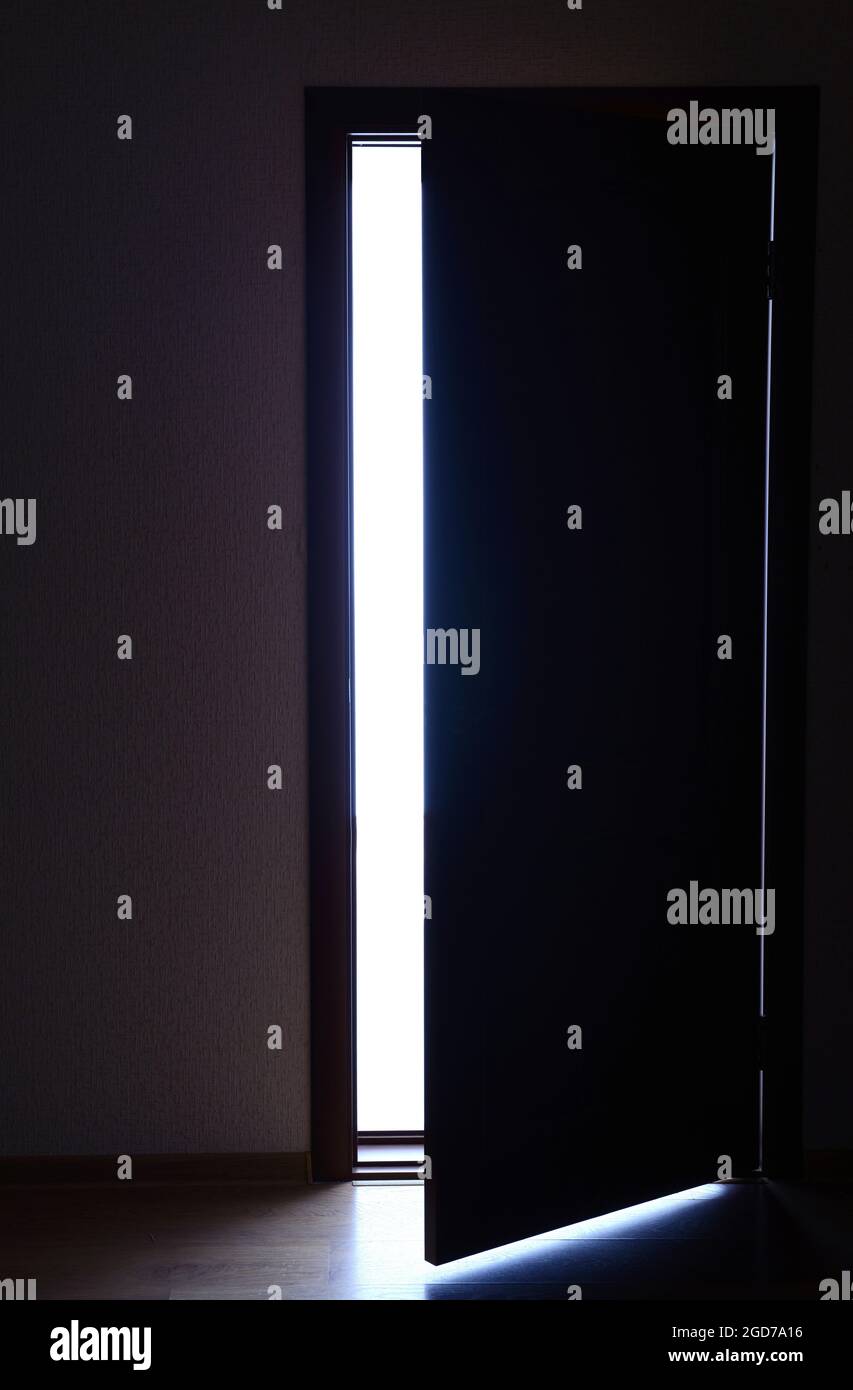 Open door with bright light outside Stock Photo - Alamy