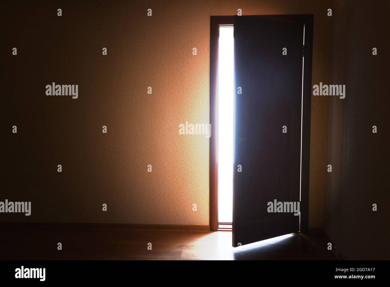 Open door with bright light outside Stock Photo - Alamy
