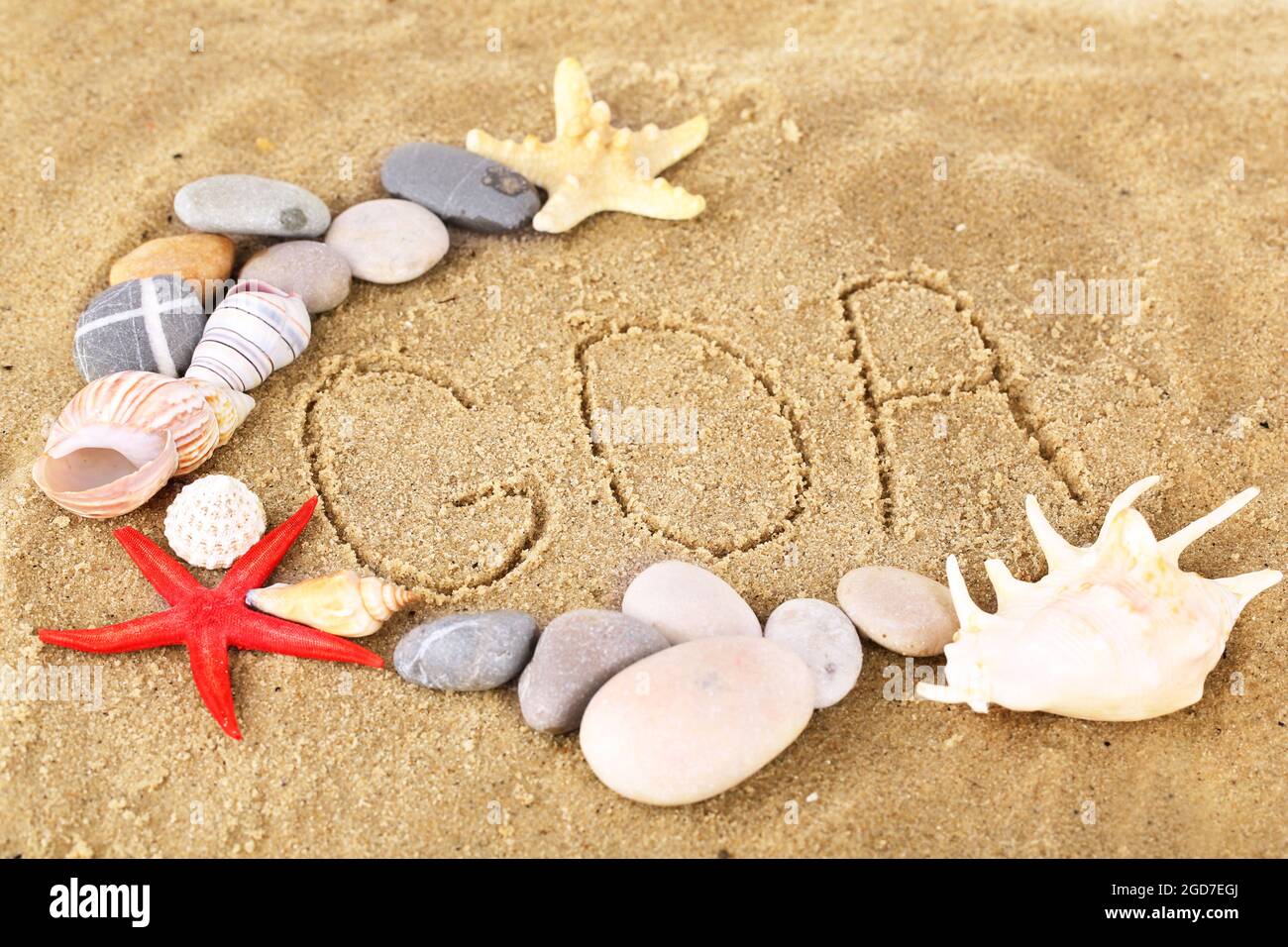 Inscription Goa in wet sand close-up background Stock Photo - Alamy