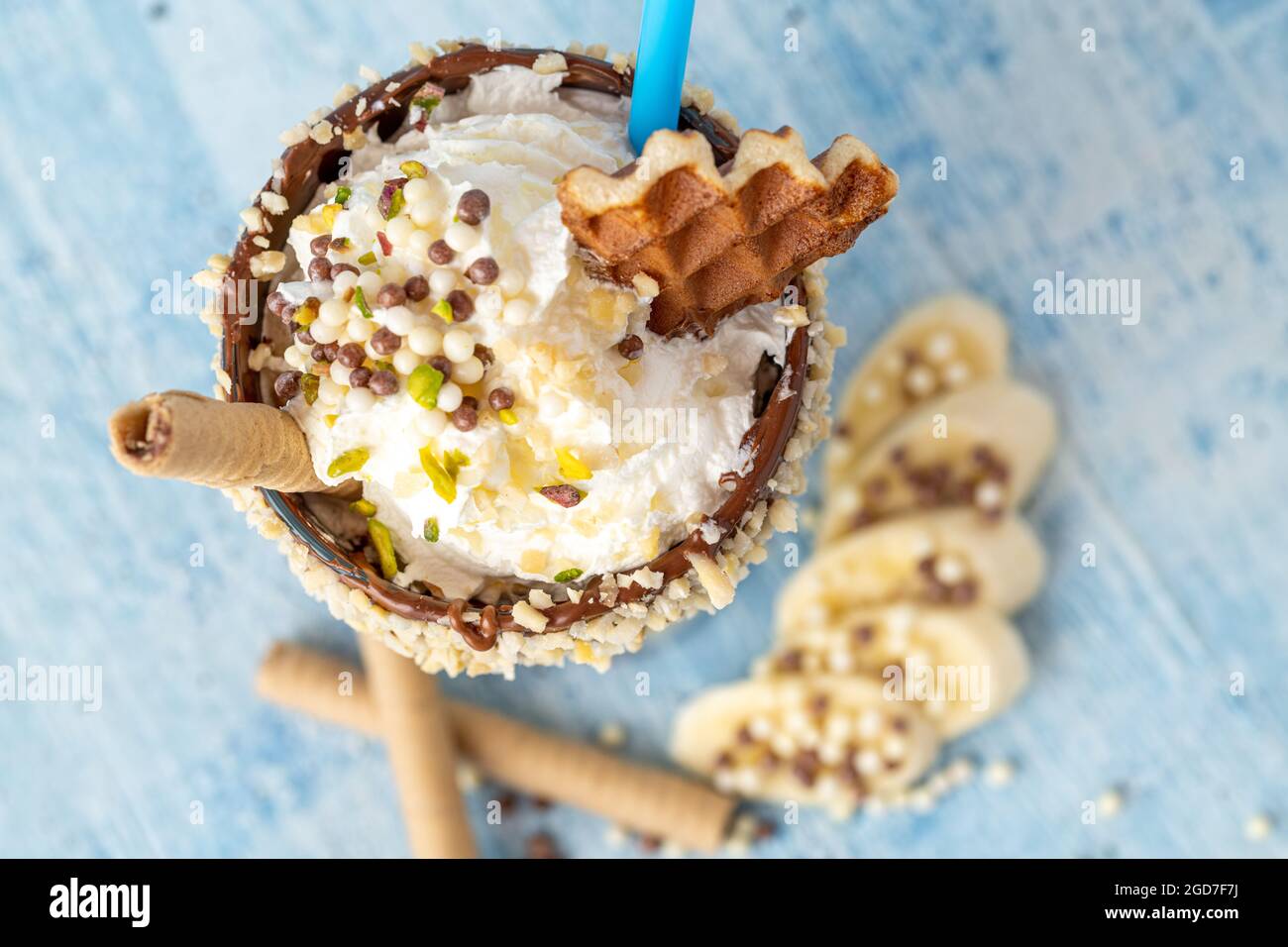 Chocolate milkshake with banana on blue background Stock Photo - Alamy