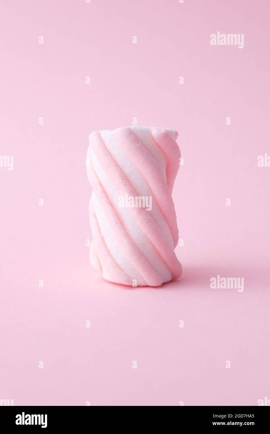 Pink and white marshmallow on pink background Stock Photo - Alamy