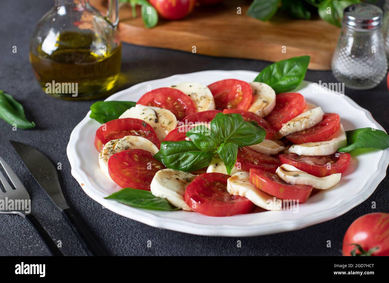 Italian Caprese salad with sliced tomatoes, mozzarella cheese, basil ...