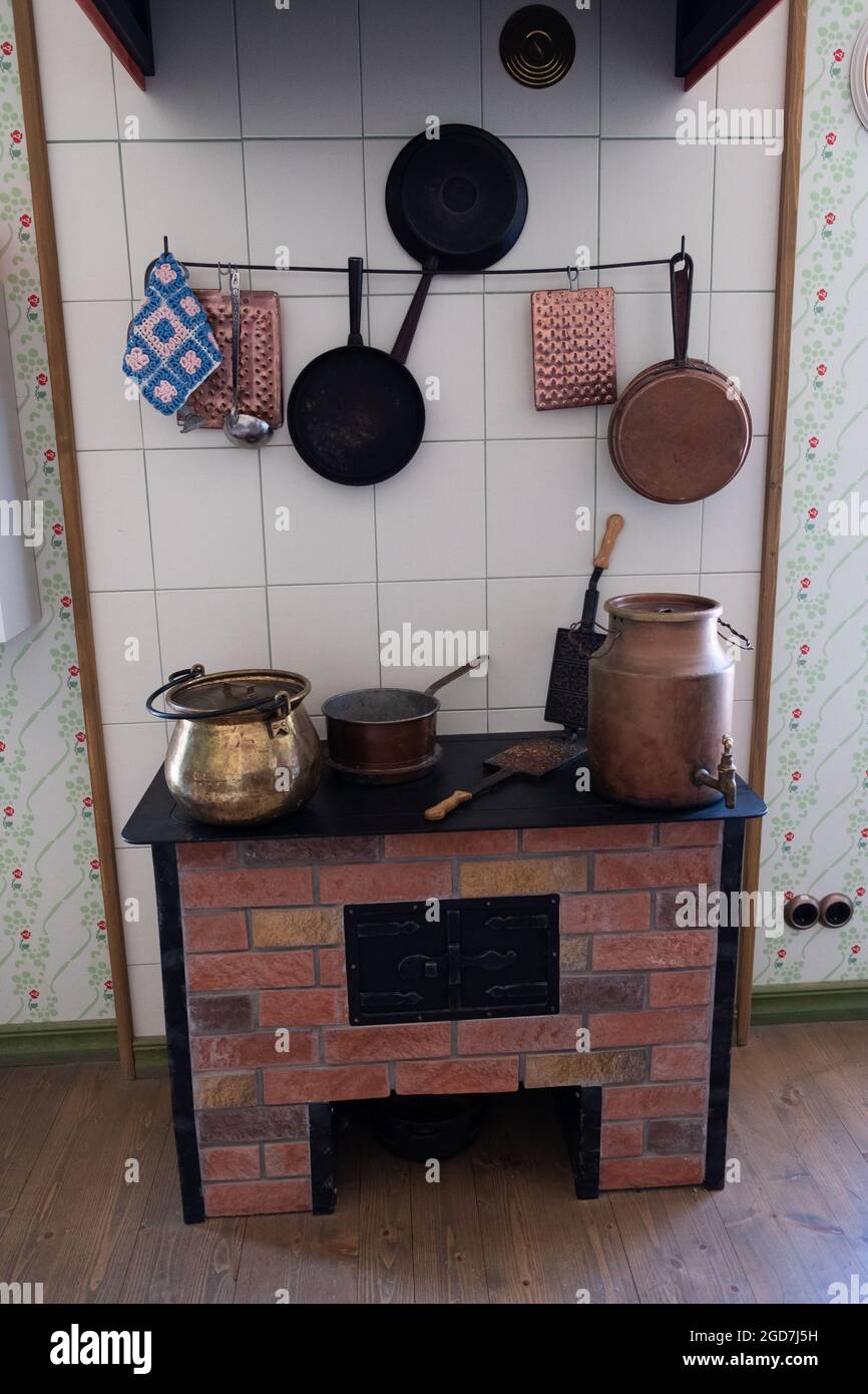 Grandma's cooking. Country style fire wood cooker Stock Photo - Alamy