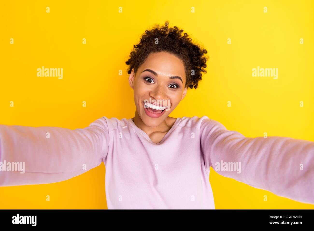 Photo of amazed excited dark skin woman make selfie good mood enjoy ...