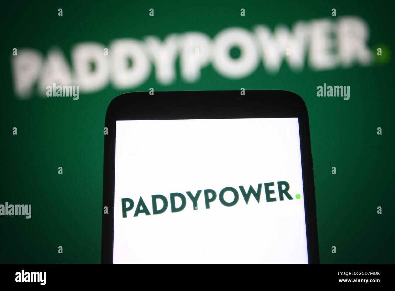 In this photo illustration a Paddy Power logo is seen on a smartphone ...