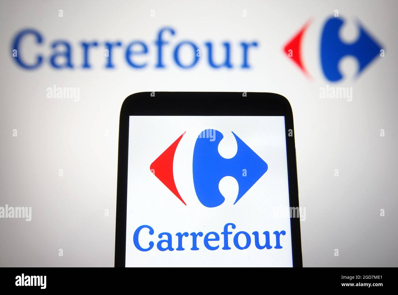 In this photo illustration a Carrefour logo of a French retail company ...