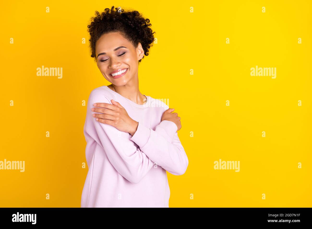 Photo of young happy afro american joyful woman hug herself smile good ...