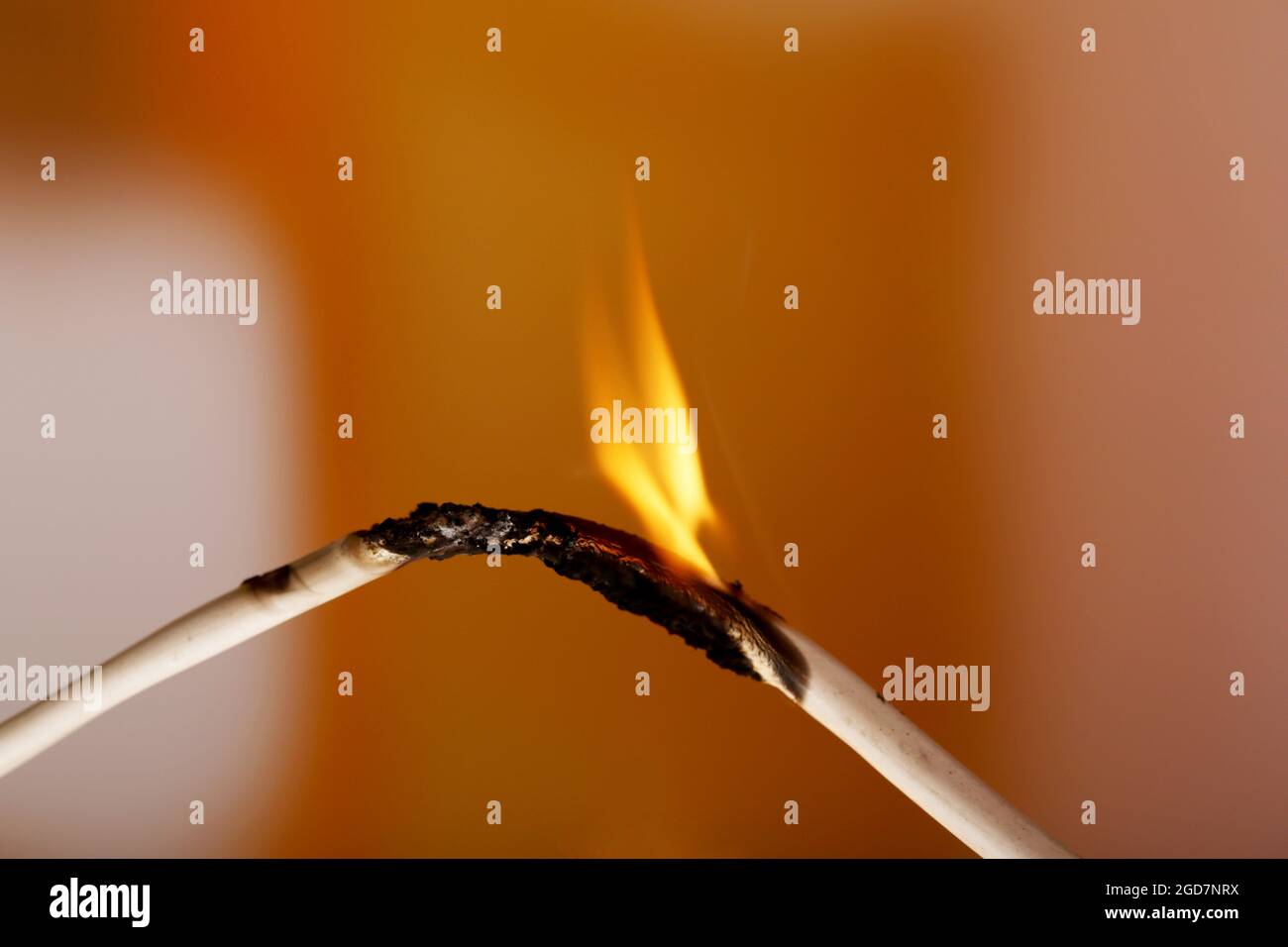 Short circuit, burnt cable, on dark color background Stock Photo - Alamy