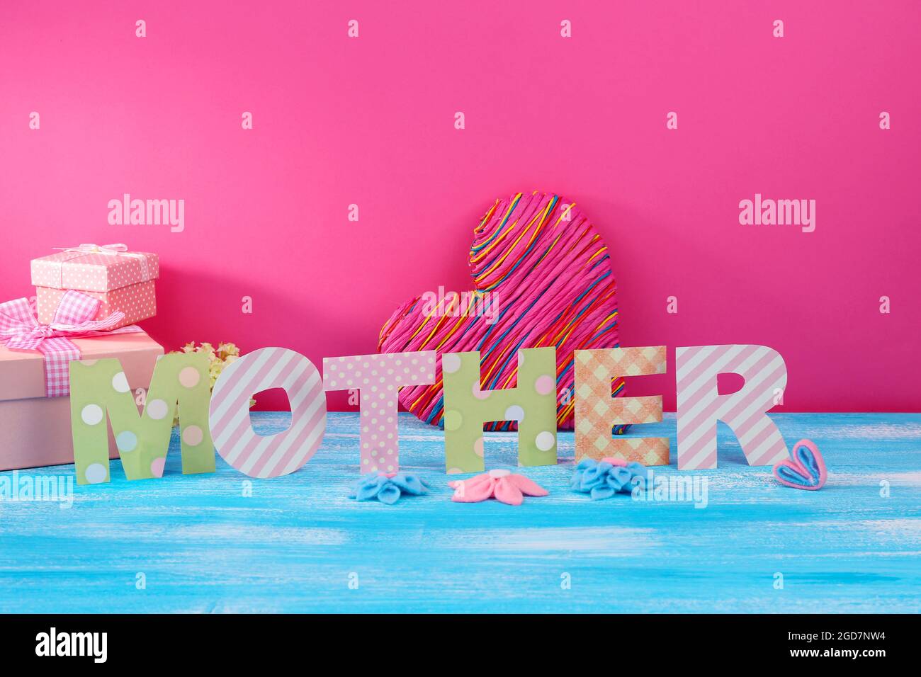 Mother- lettering of handmade paper letters on pink background Stock ...
