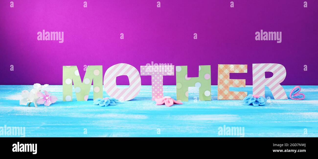 Mother- lettering of handmade paper letters on purple background Stock ...
