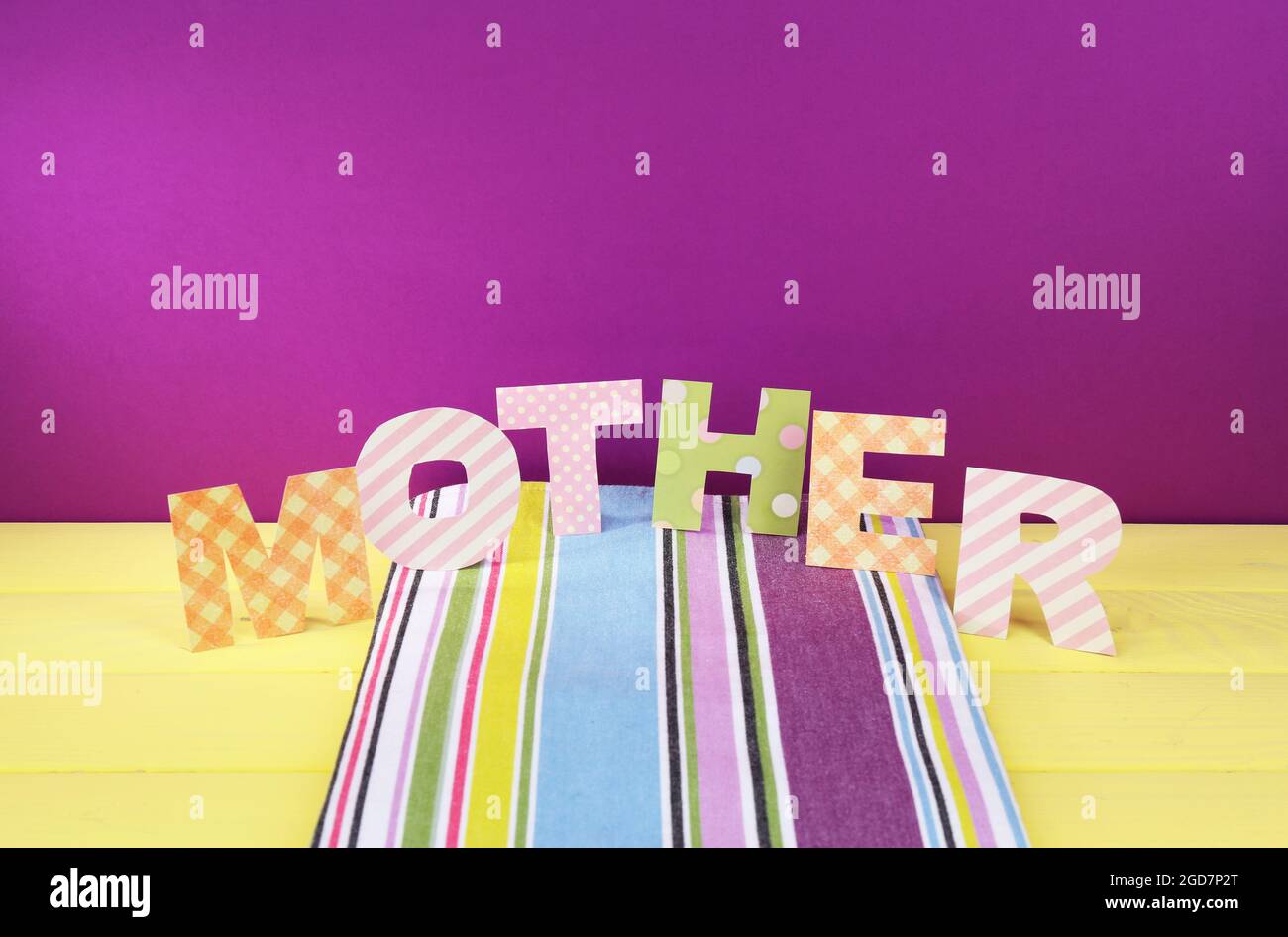 Mother- lettering of handmade paper letters on purple background Stock ...