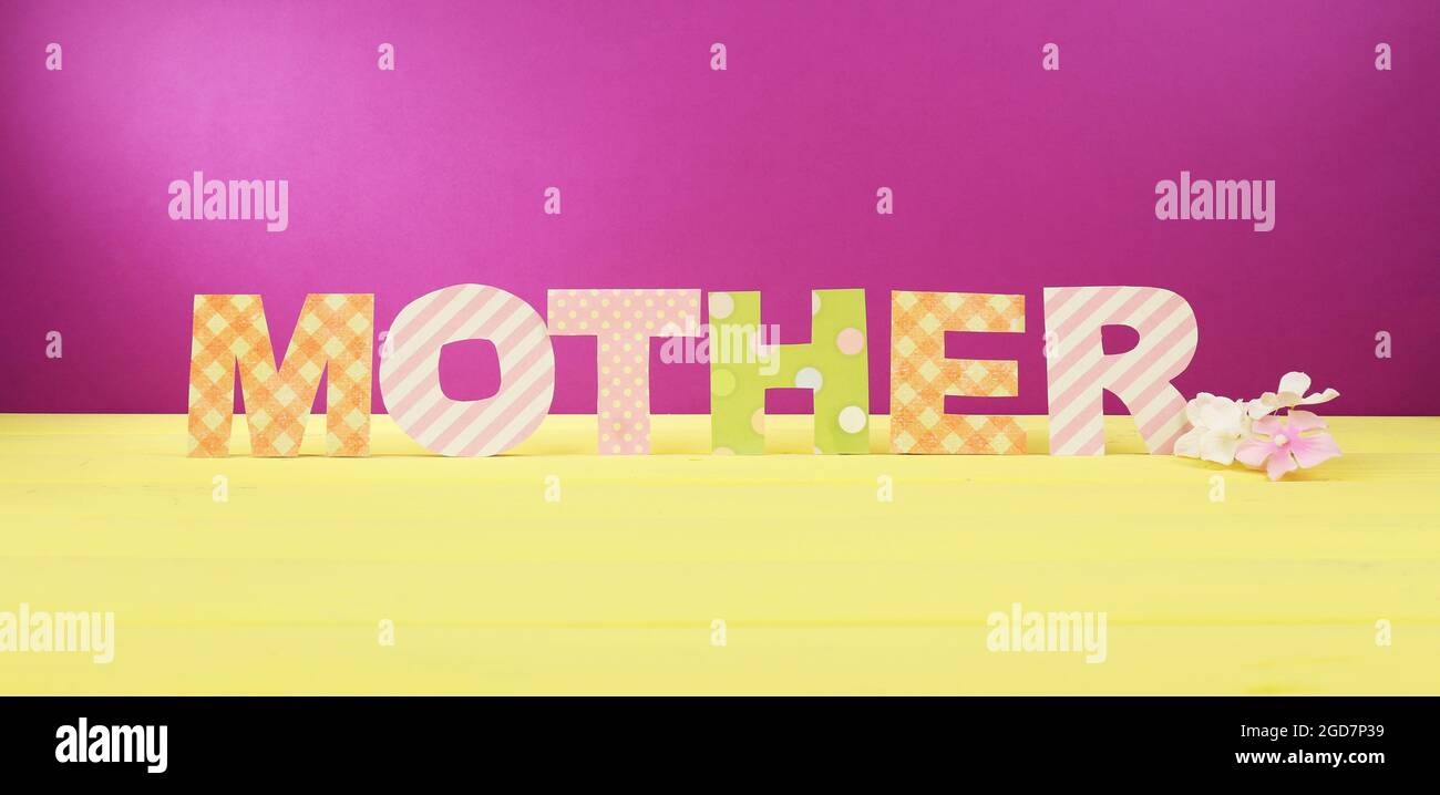 Mother- lettering of handmade paper letters on purple background Stock ...