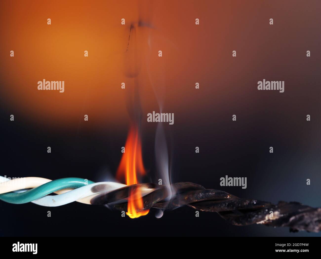 Short circuit, burnt cable, on dark color background Stock Photo - Alamy
