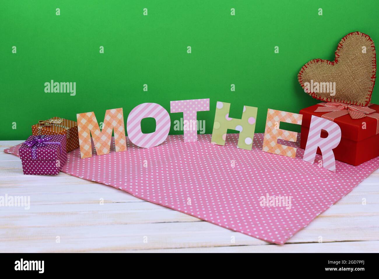 Mother- lettering of handmade paper letters on green background Stock ...
