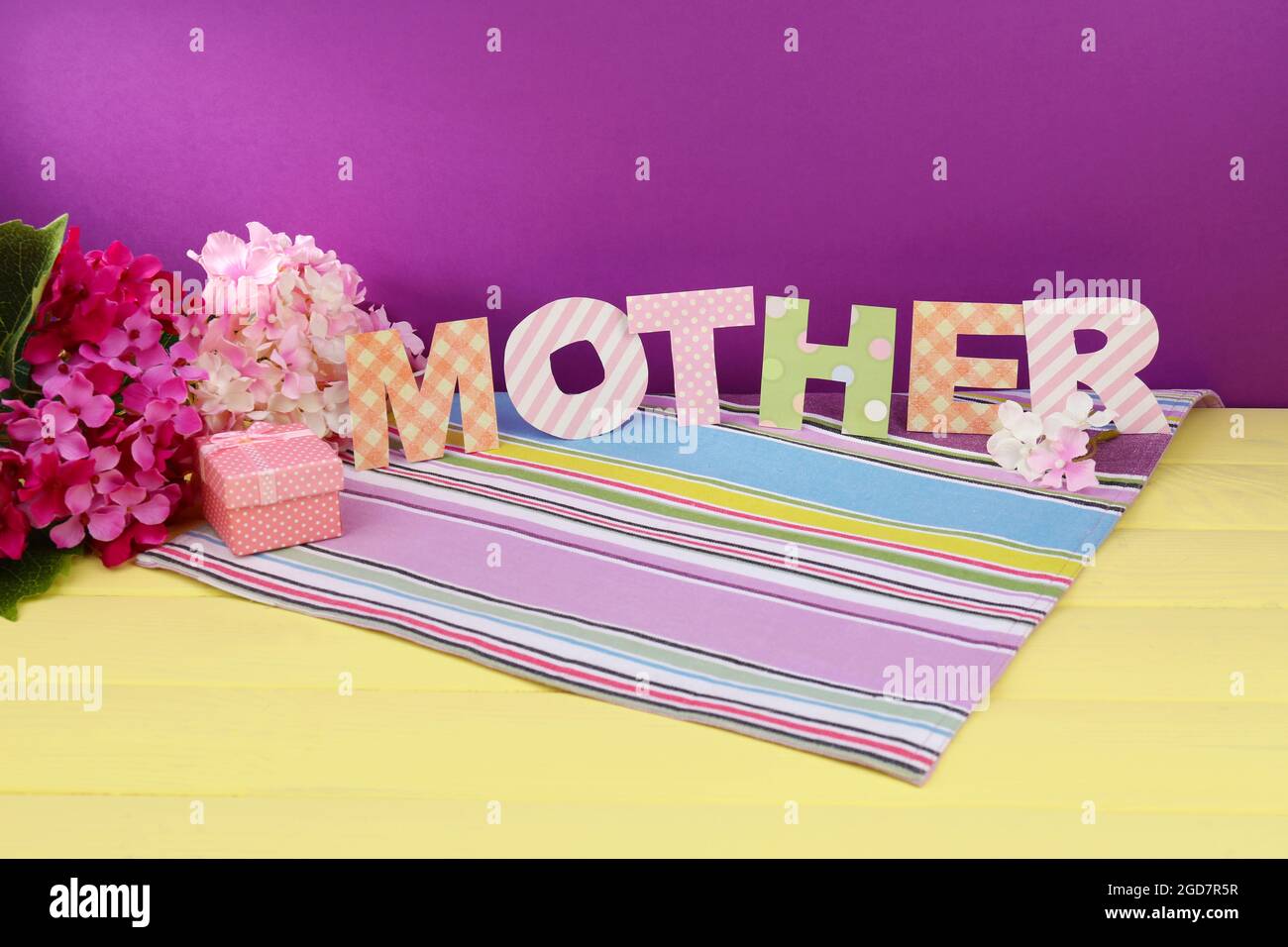Mother- lettering of handmade paper letters on purple background Stock ...
