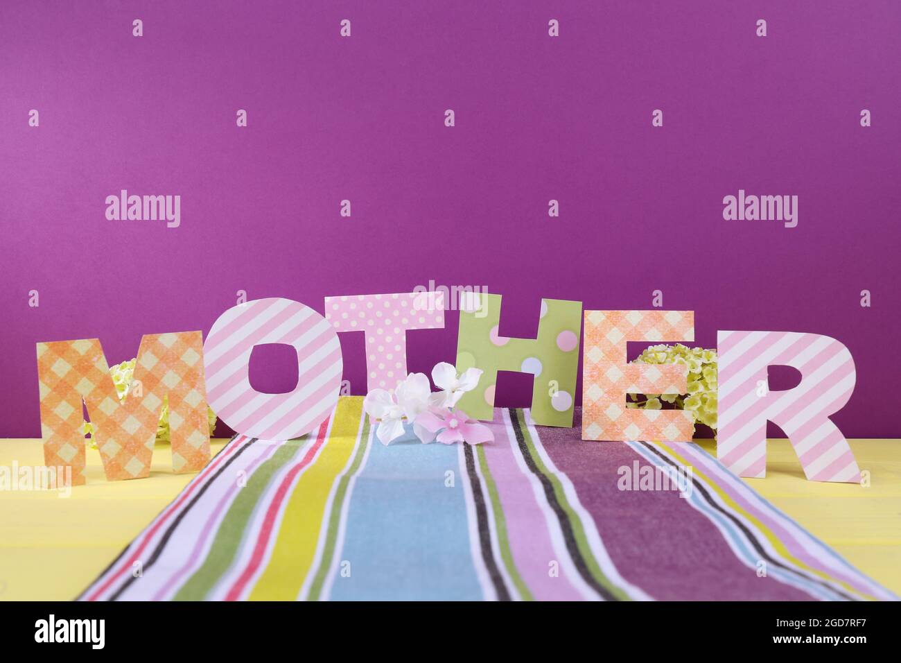 Mother- lettering of handmade paper letters on purple background Stock ...