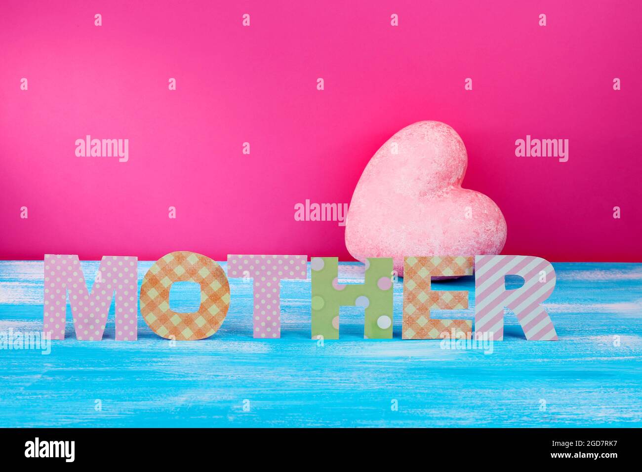 Mother- lettering of handmade paper letters on pink background Stock ...