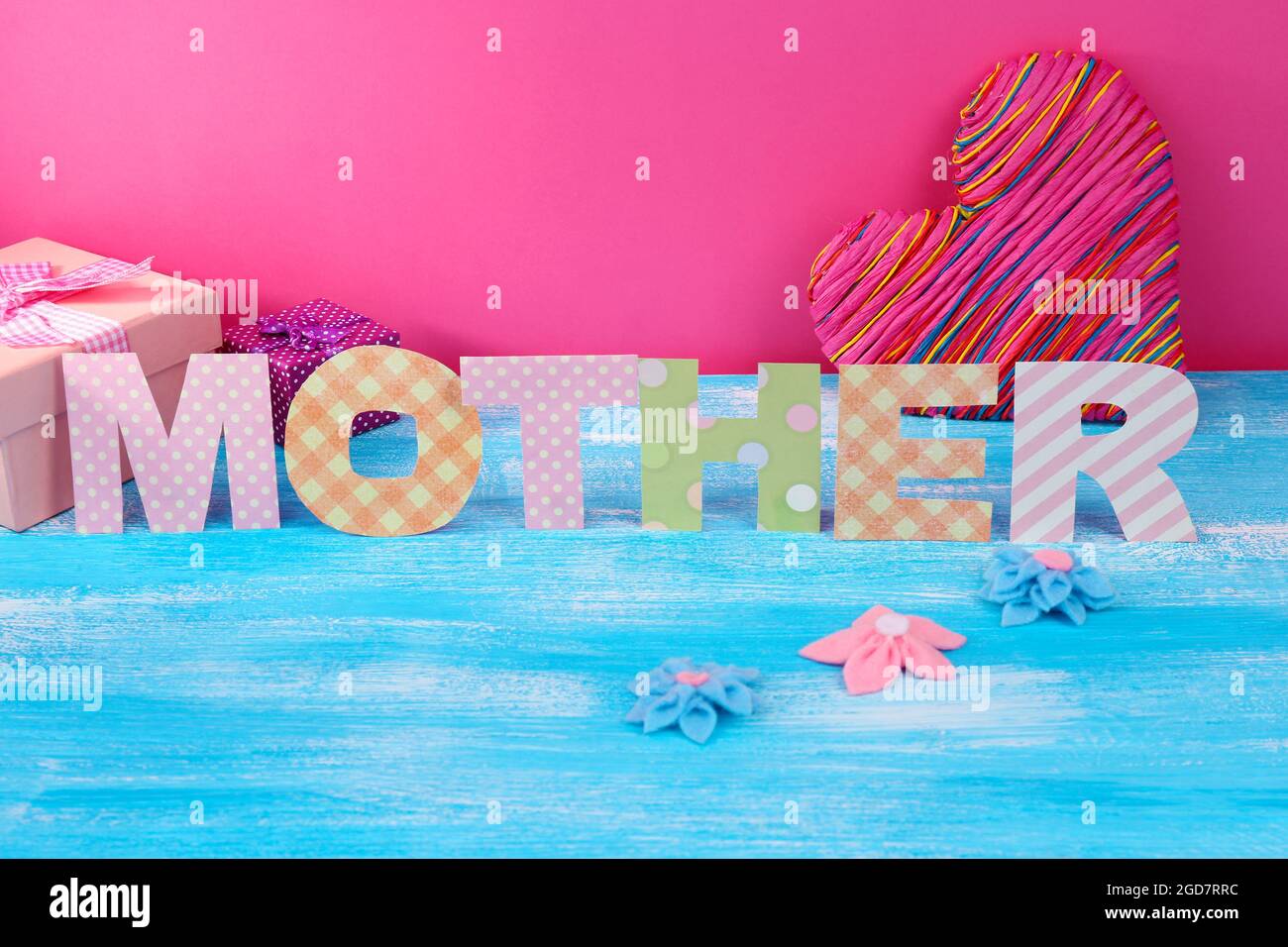 Mother- lettering of handmade paper letters on pink background Stock ...